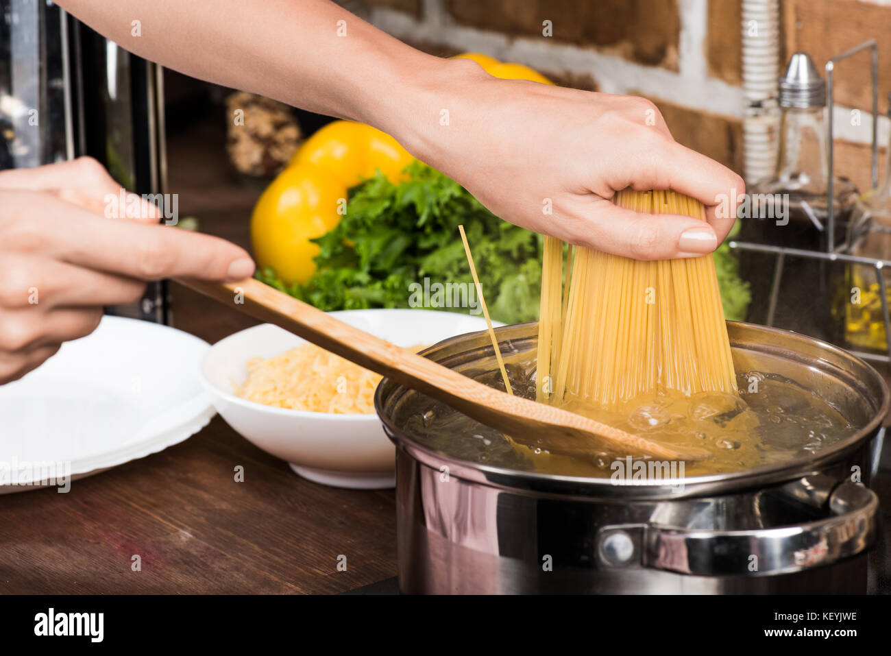 woman cooking pasta for dinner Stock Photo - Alamy