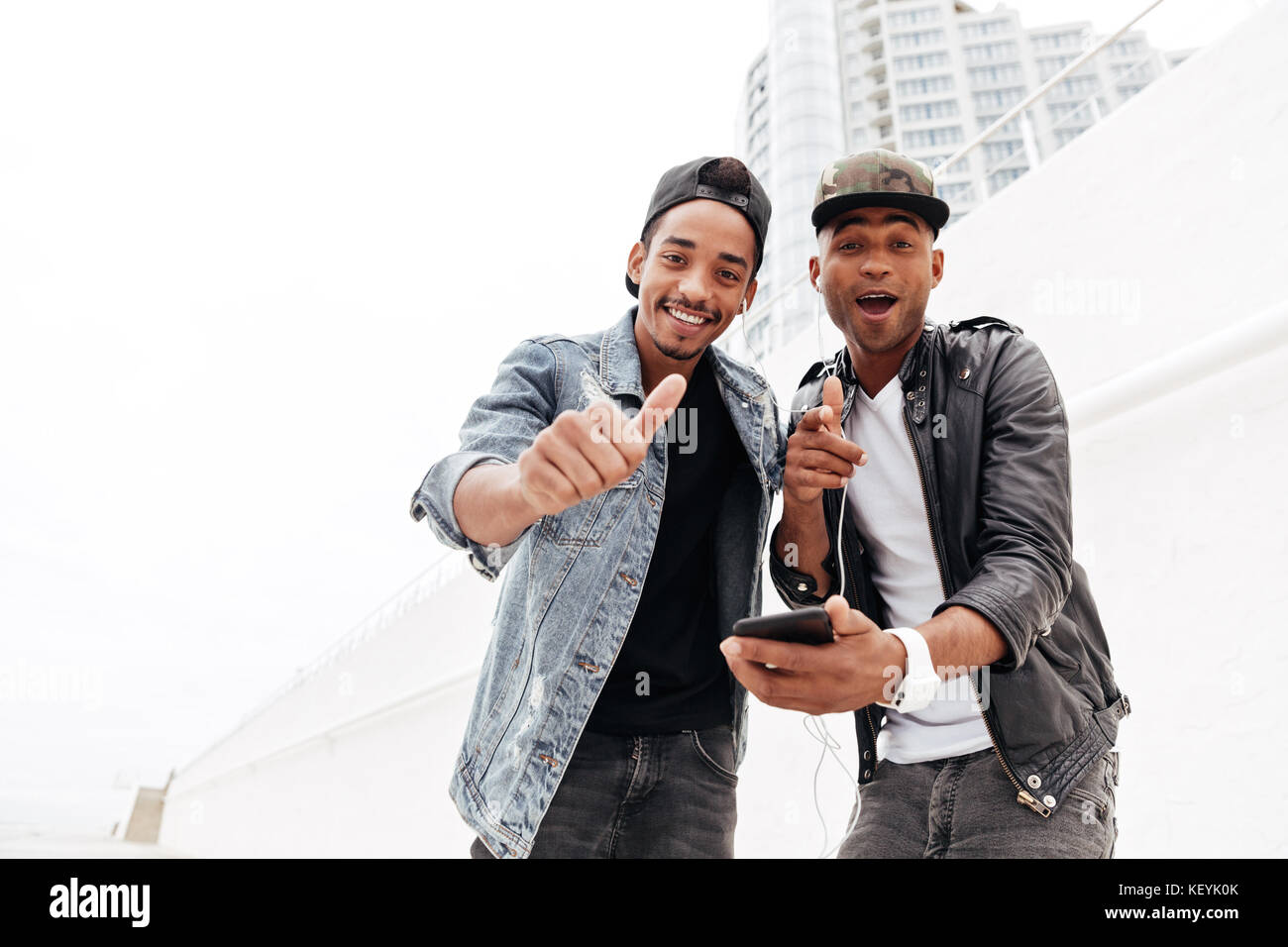 Image of cheerful two young african men friends walking outdoors ...