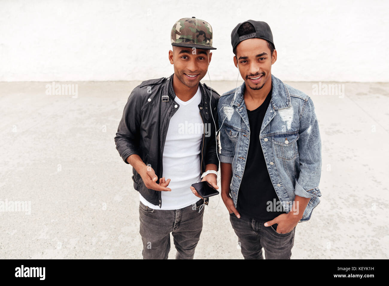 Image of smiling two young african men friends walking outdoors ...