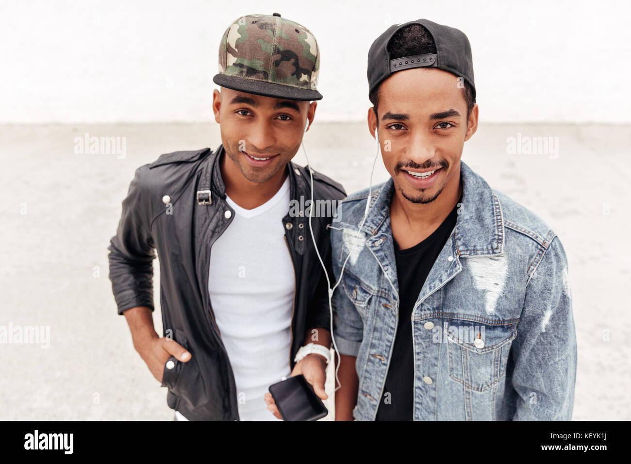 Image of smiling two young african men friends walking outdoors ...