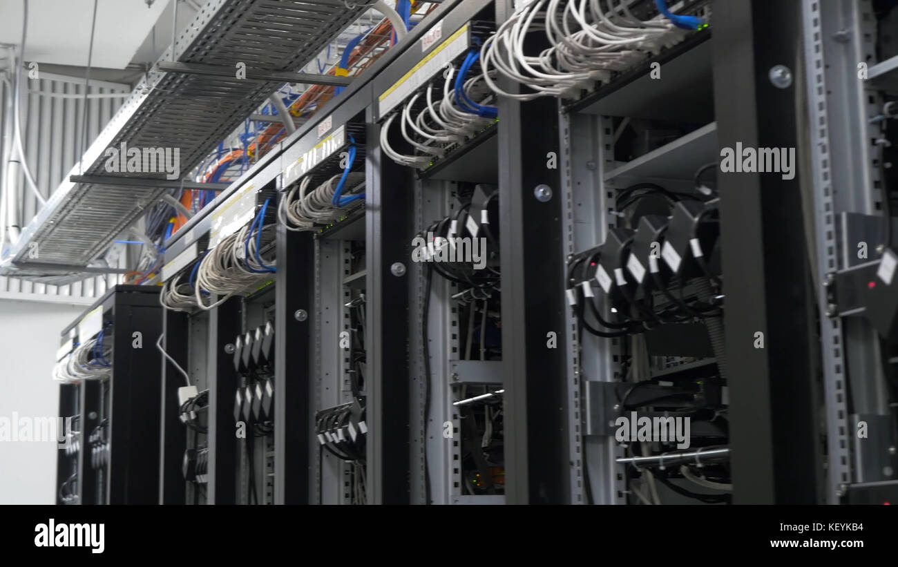 Device for mining crypto currency. Row of bitcoin miners set up on the ...