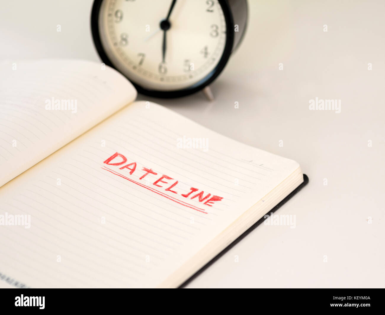 Blank notebook with Dateline written with a clock Stock Photo - Alamy
