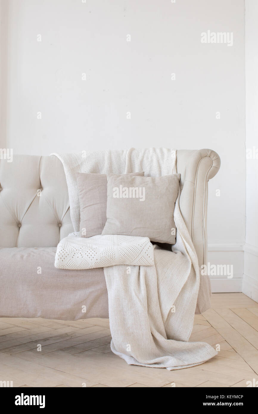 Small sofa in room on a white background Stock Photo - Alamy