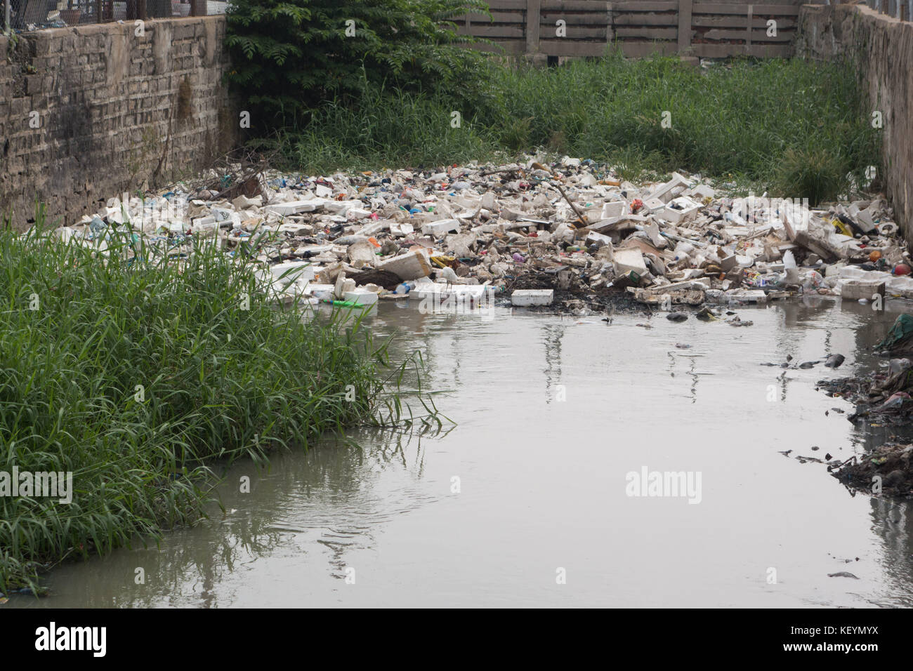 HYDERABAD, INDIA - OCTOBER 22,2017 Sewage canal clogged by floating ...