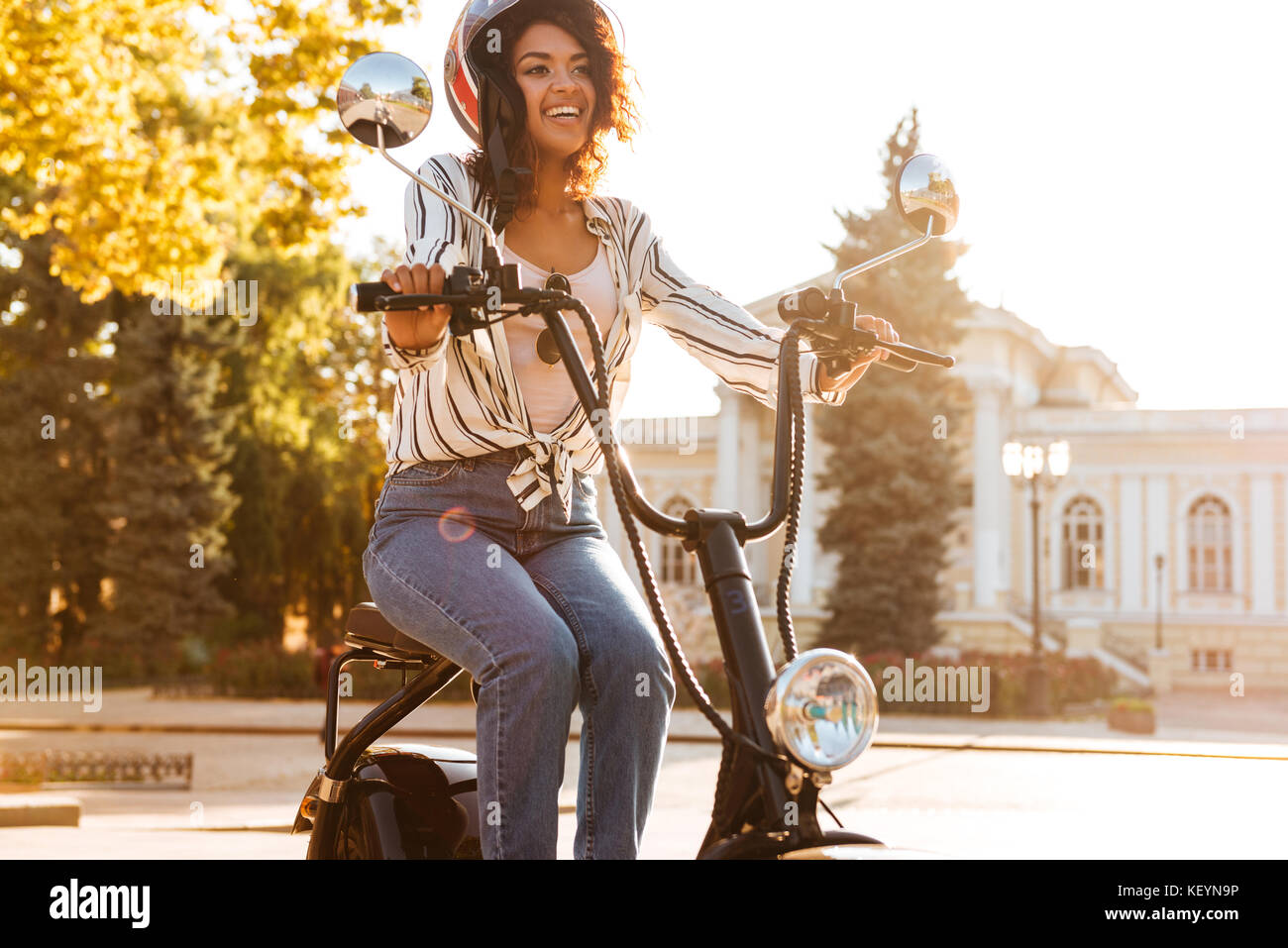 African woman on motorcycle hi-res stock photography and images - Alamy