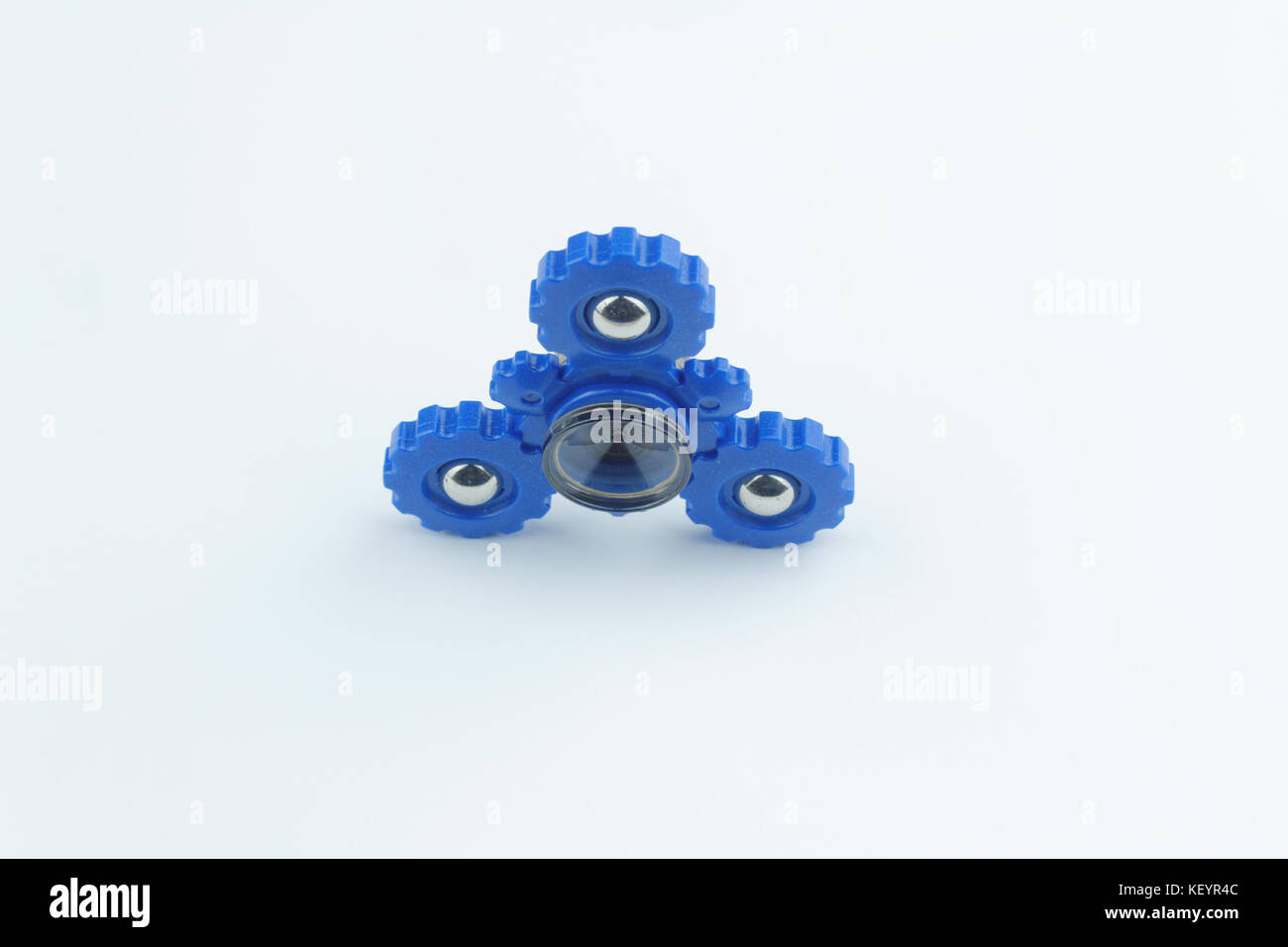 Blue color fidget finger spinner stress and relief toy Stock Photo - Alamy