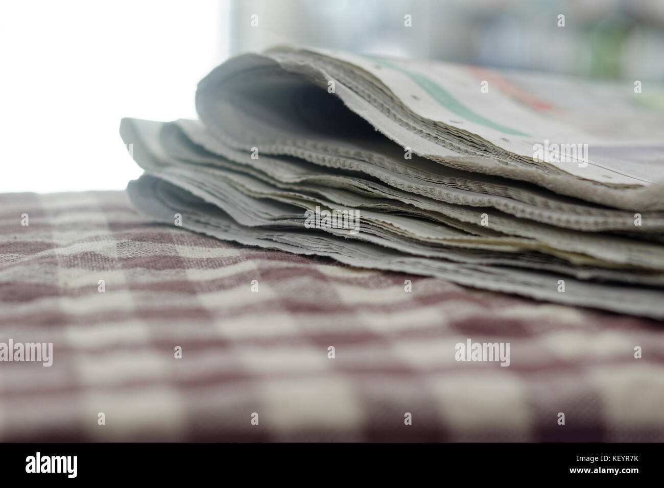 Blurred image of newspaper on the table Stock Photo - Alamy