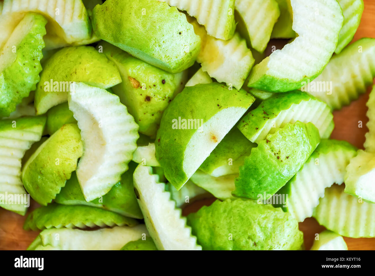 Slice of fresh guava fruit on Chopping board Stock Photo - Alamy