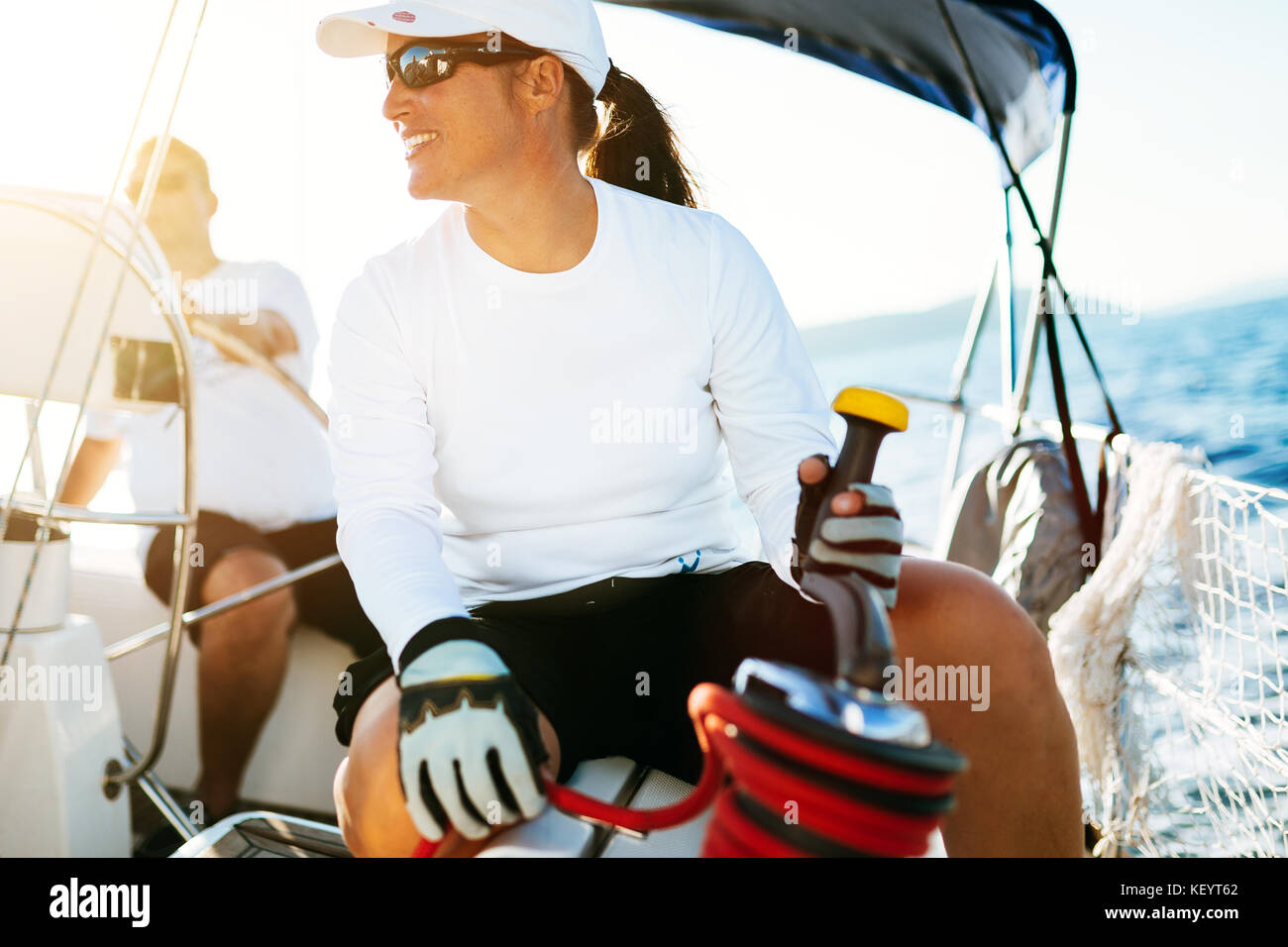 Attractive strong woman sailing with her boat Stock Photo - Alamy