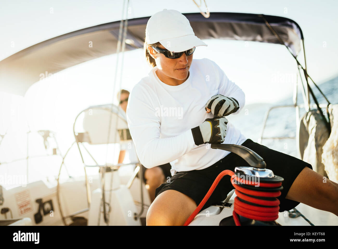 Attractive strong woman sailing with her boat Stock Photo - Alamy