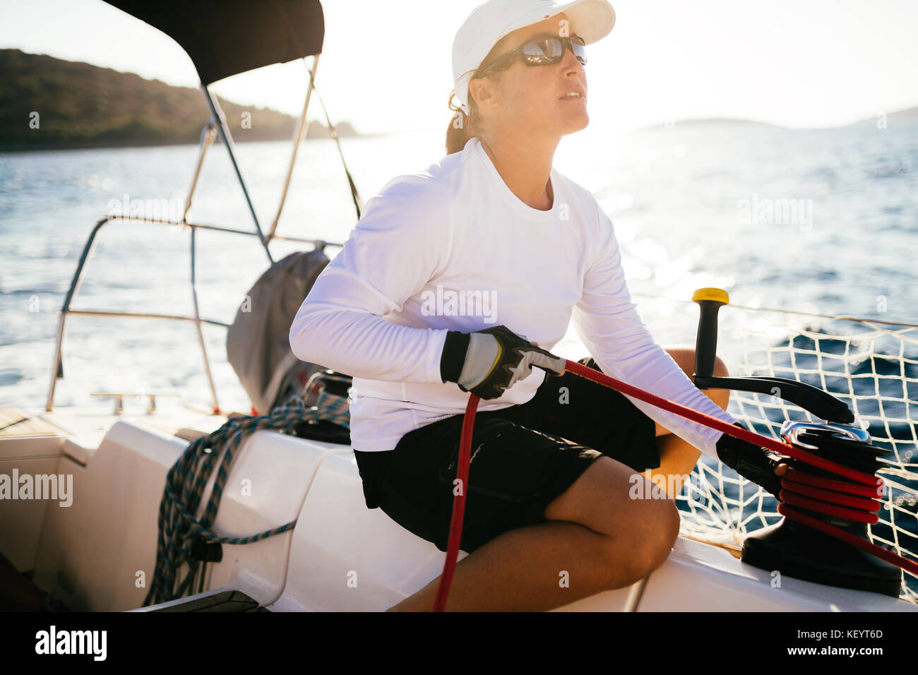 Attractive strong woman sailing with her boat Stock Photo - Alamy
