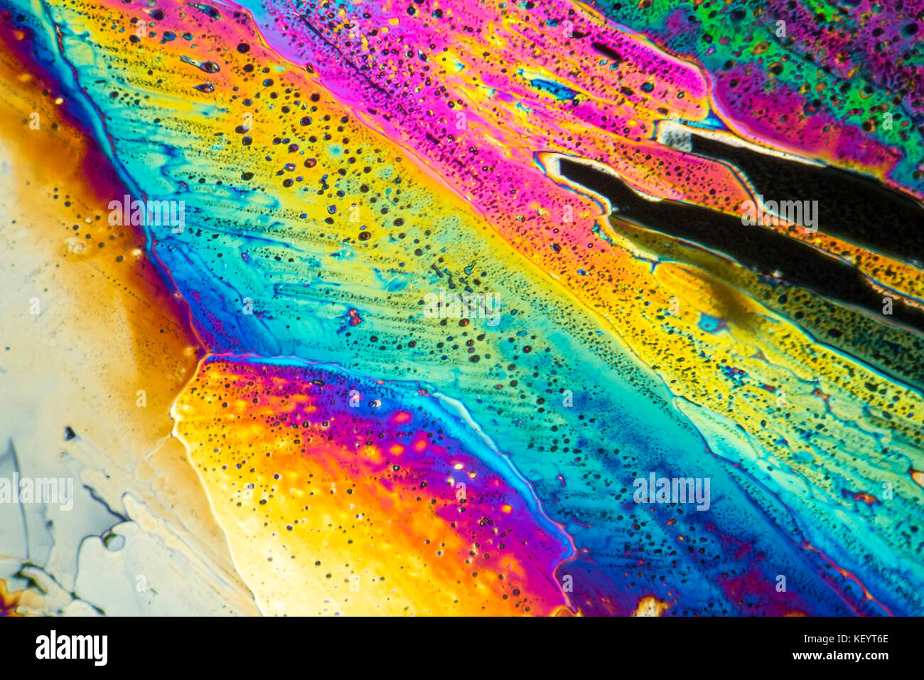 colorful microscopic shot of Sodium acetate micro crystals in polarized ...