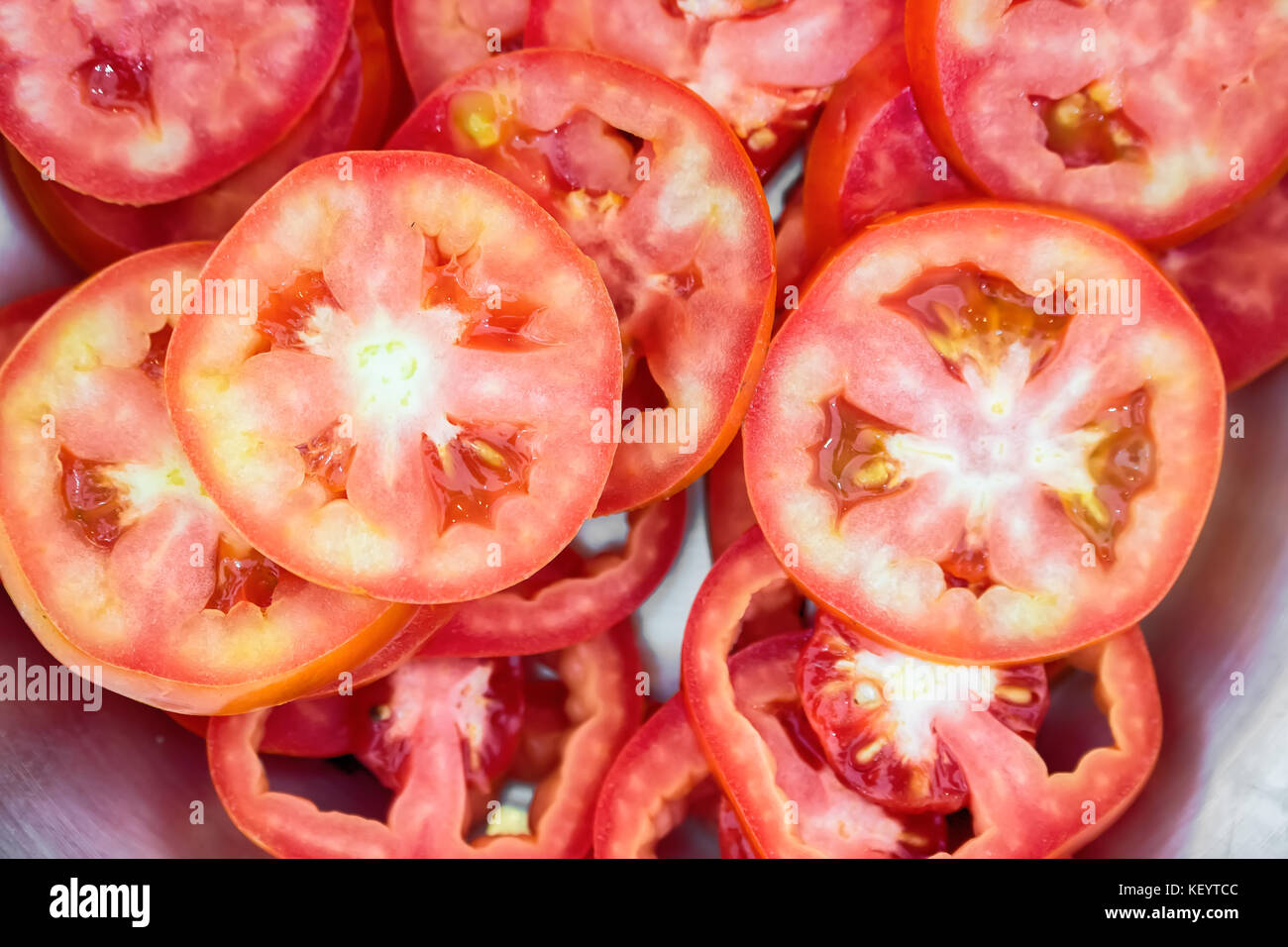 Tomatoes slice background Stock Photo - Alamy