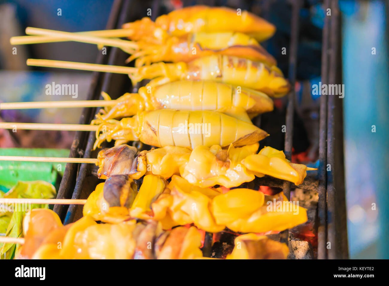 Squid seafood in BBQ Flames Stock Photo - Alamy