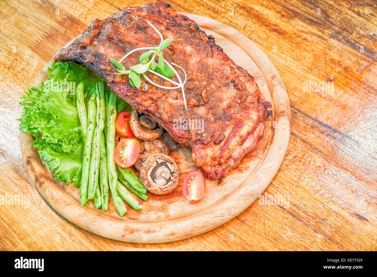 Tasty grilled ribs with vegetables Stock Photo - Alamy