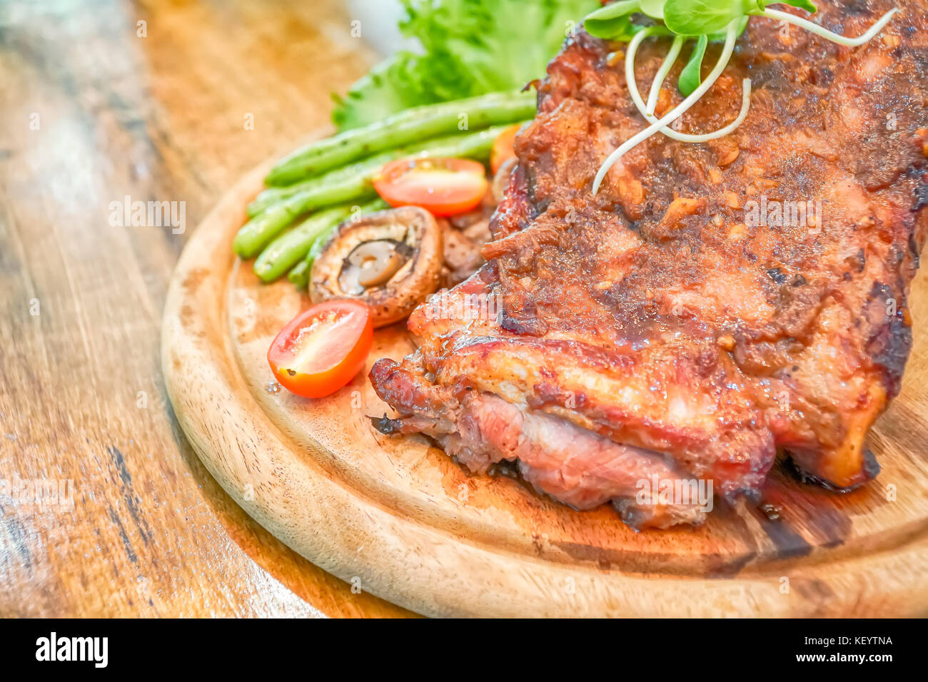 Tasty grilled ribs with vegetables Stock Photo - Alamy