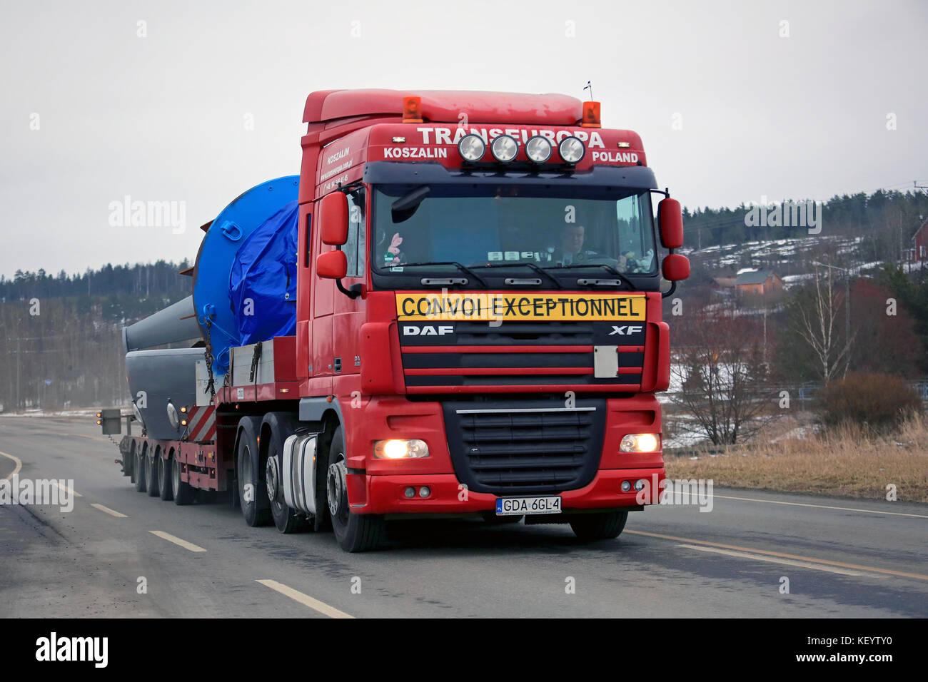 SALO, FINLAND - MARCH 11, 2016: Red DAF XF 105 semi truck haul ...