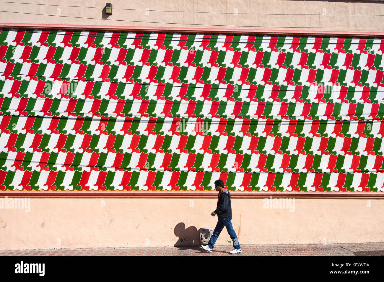 January 17, 2016 Saltillo, Mexico: a man walks by a large mosaic of ...