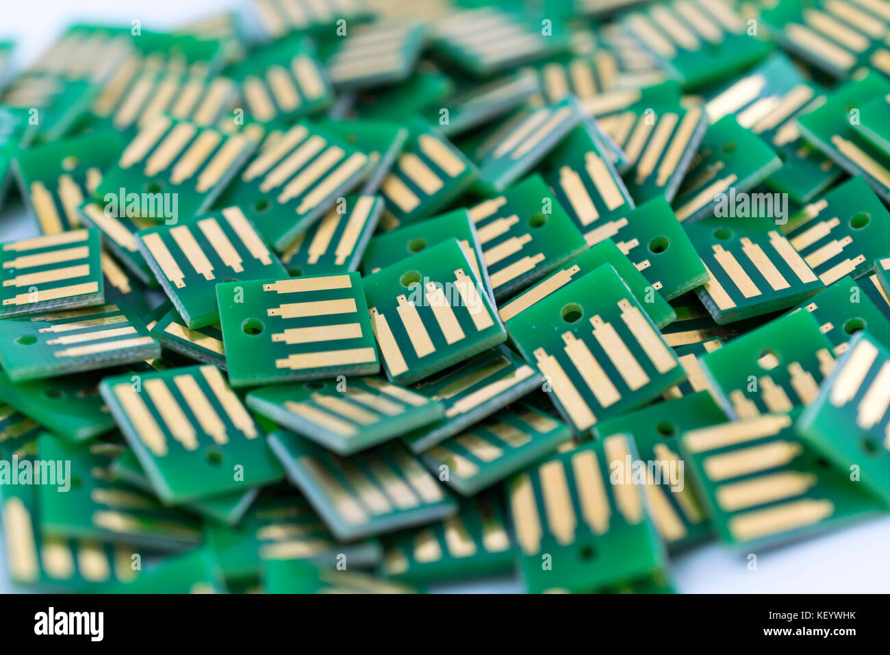 Pile of many green chips on white background Stock Photo - Alamy