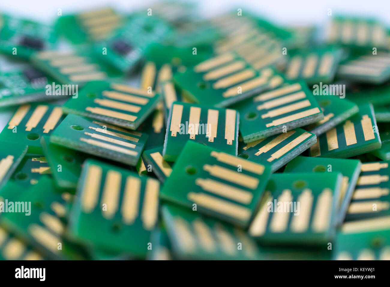 Pile of many green chips on white background Stock Photo - Alamy