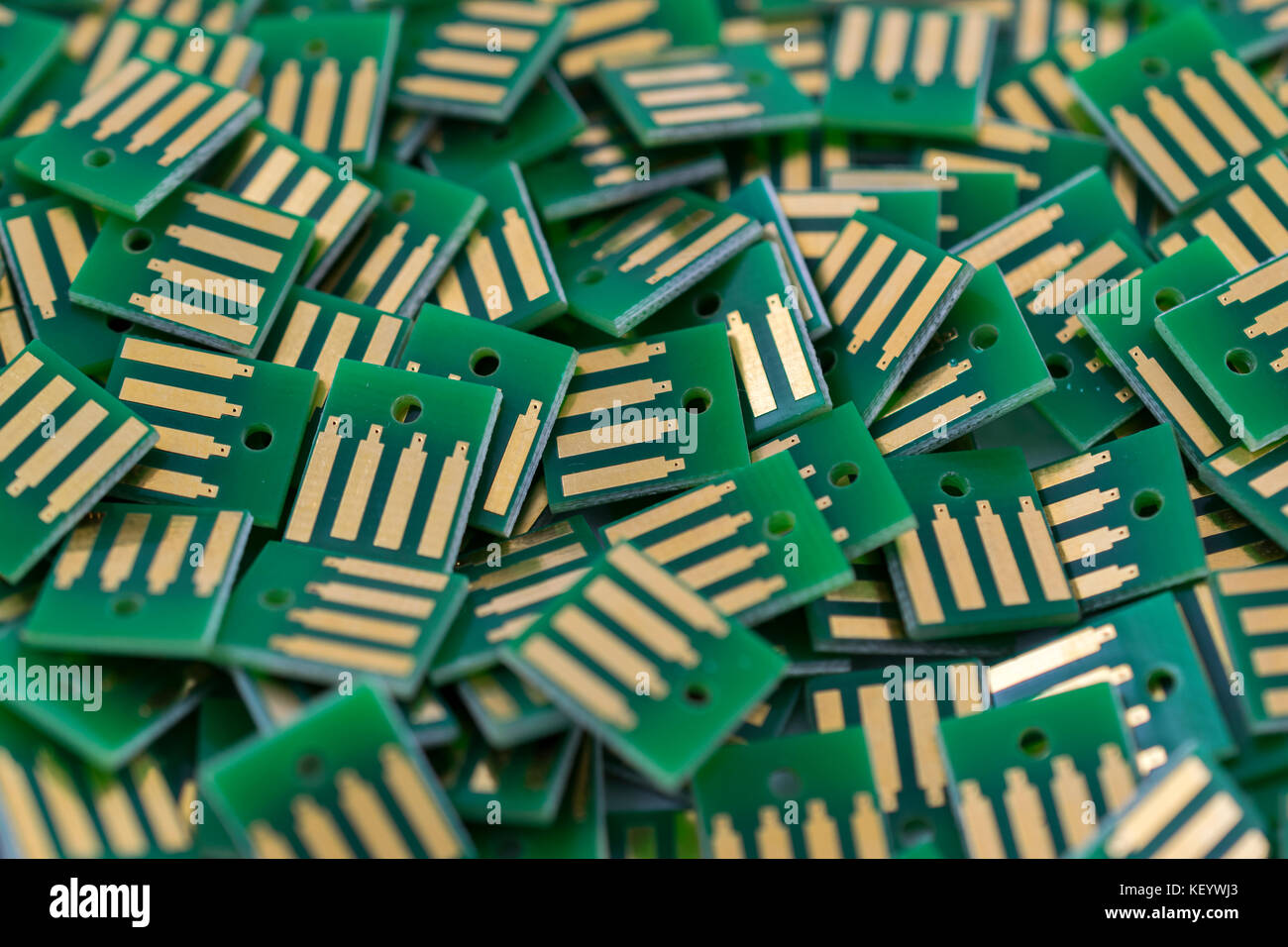 Pile of many green chips on white background Stock Photo - Alamy