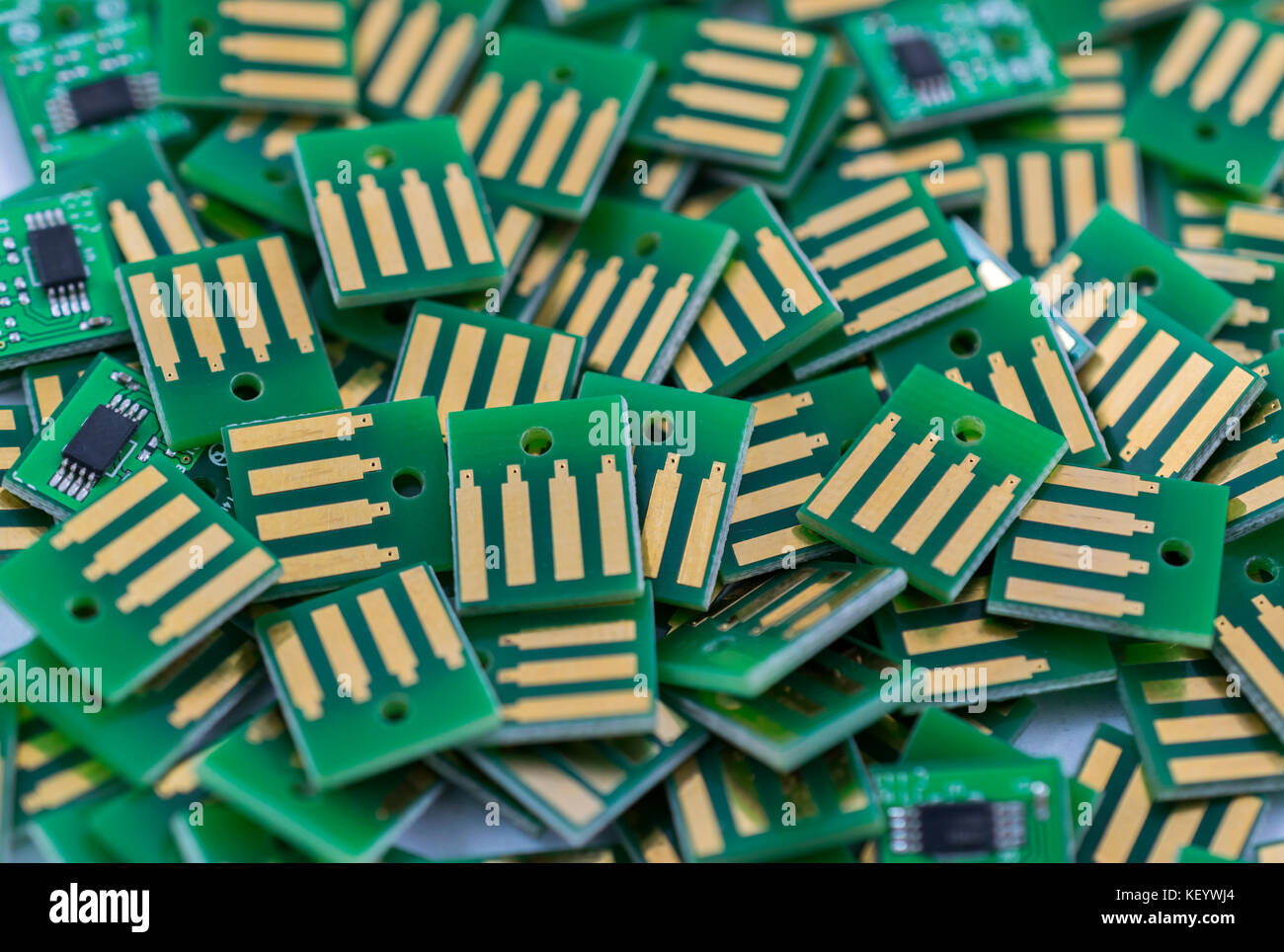 Pile of many green chips on white background Stock Photo - Alamy