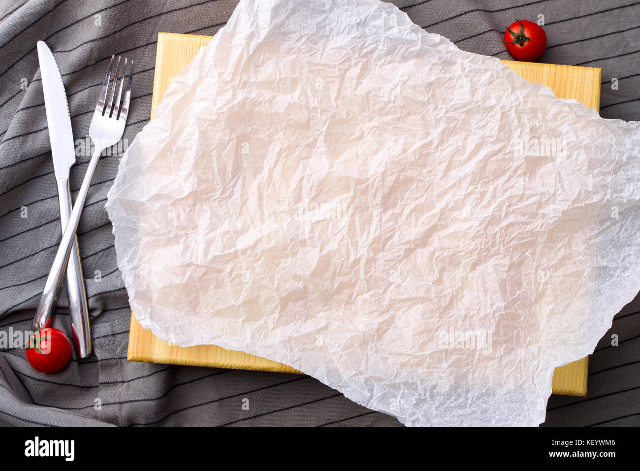 Empty old wooden table with table utensils Stock Photo - Alamy