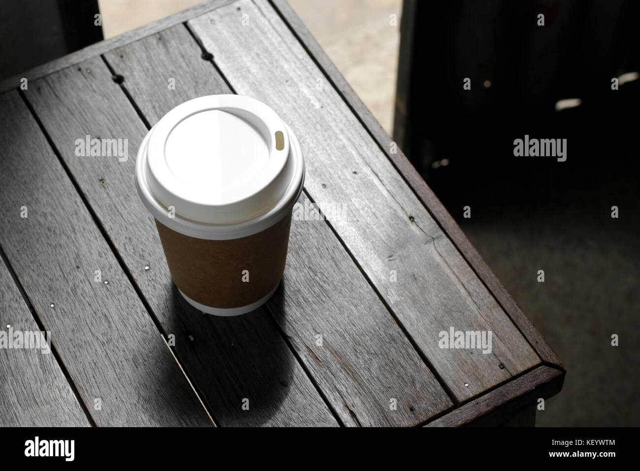 hot coffee in takeaway cup on wooden table Stock Photo - Alamy