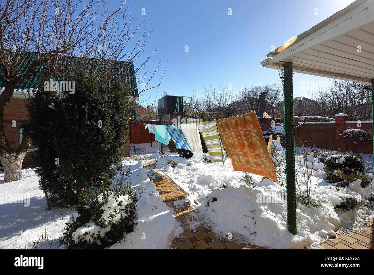 Backyard snow sun hi-res stock photography and images - Alamy