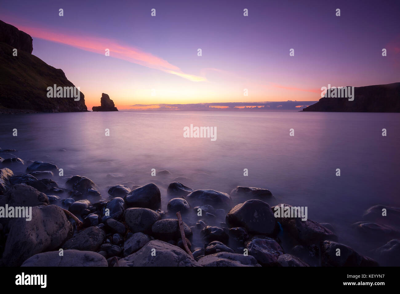 Sunset image at Talisker Bay on the Isle of Skye looking out to cliffs ...