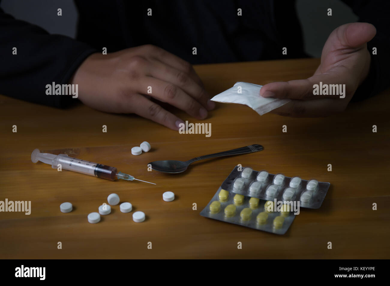 man substance dependence medication Drug syringe and cooked heroin ...