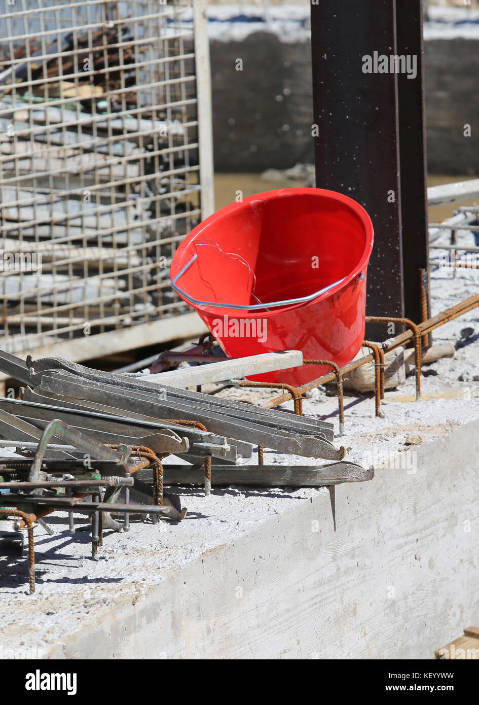 red plastic bucket in the construction site during the masonry strike ...