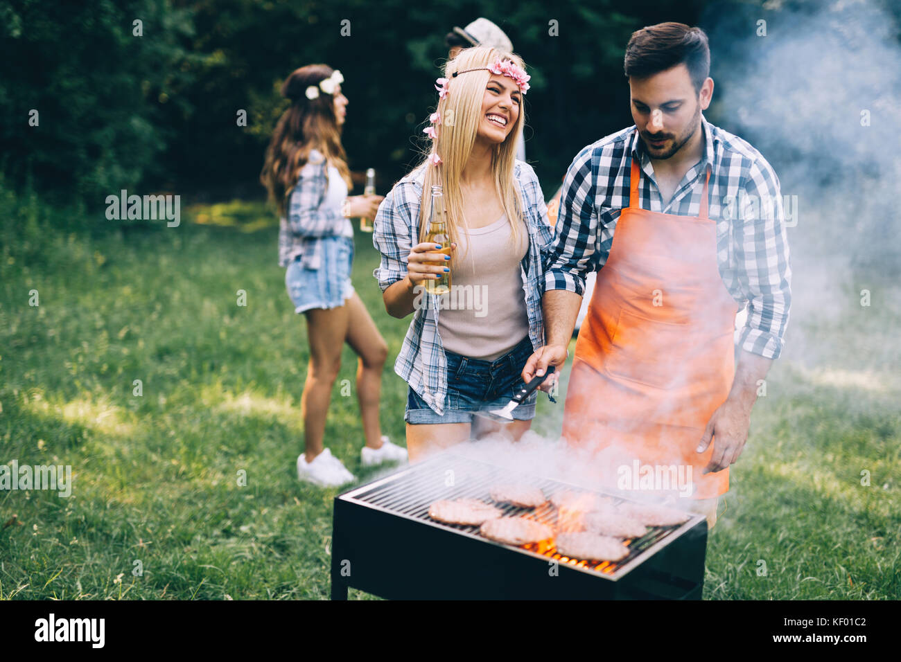 Friends spending time in nature and having barbecue Stock Photo - Alamy