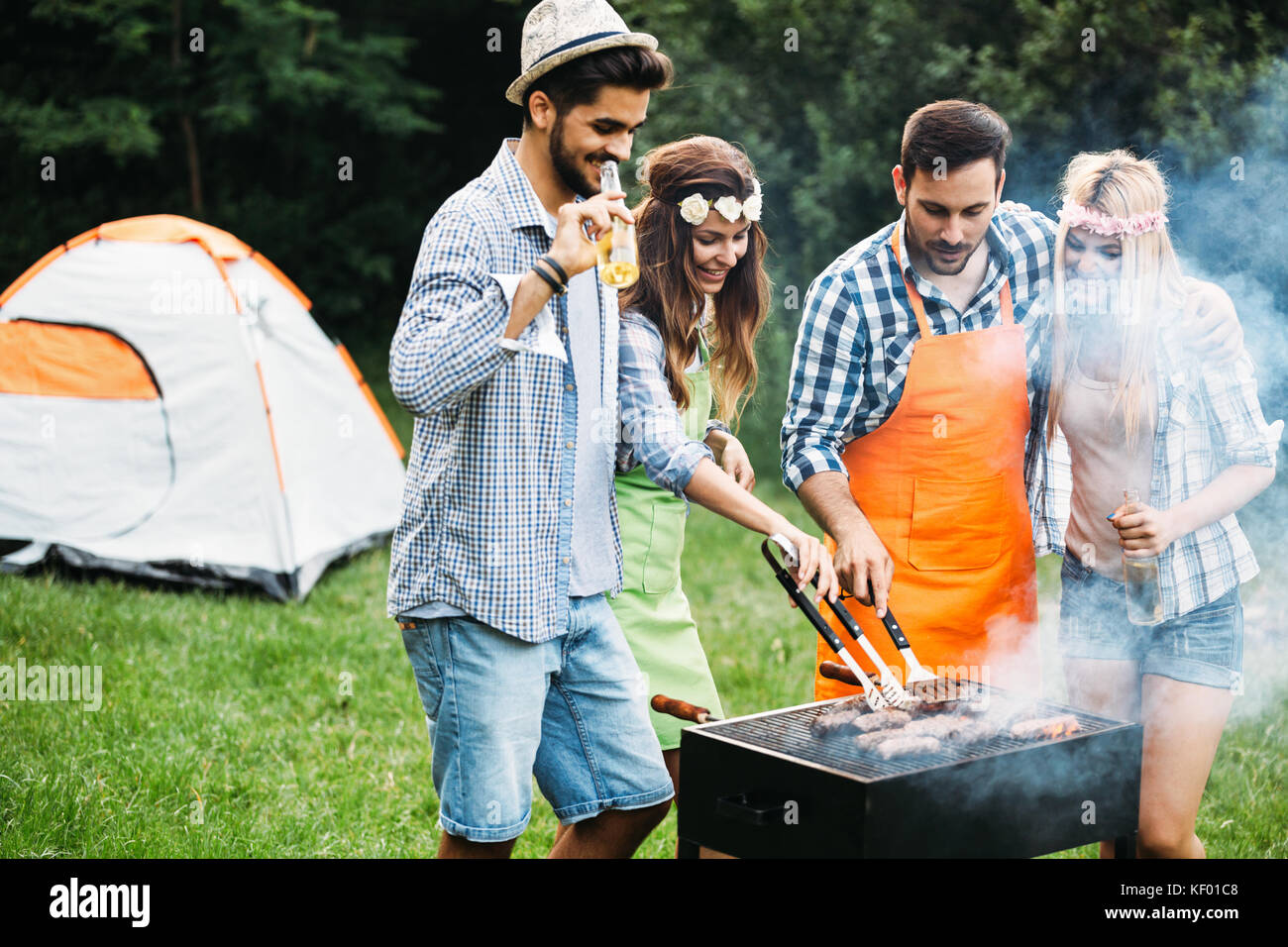 Friends spending time in nature and having barbecue Stock Photo - Alamy