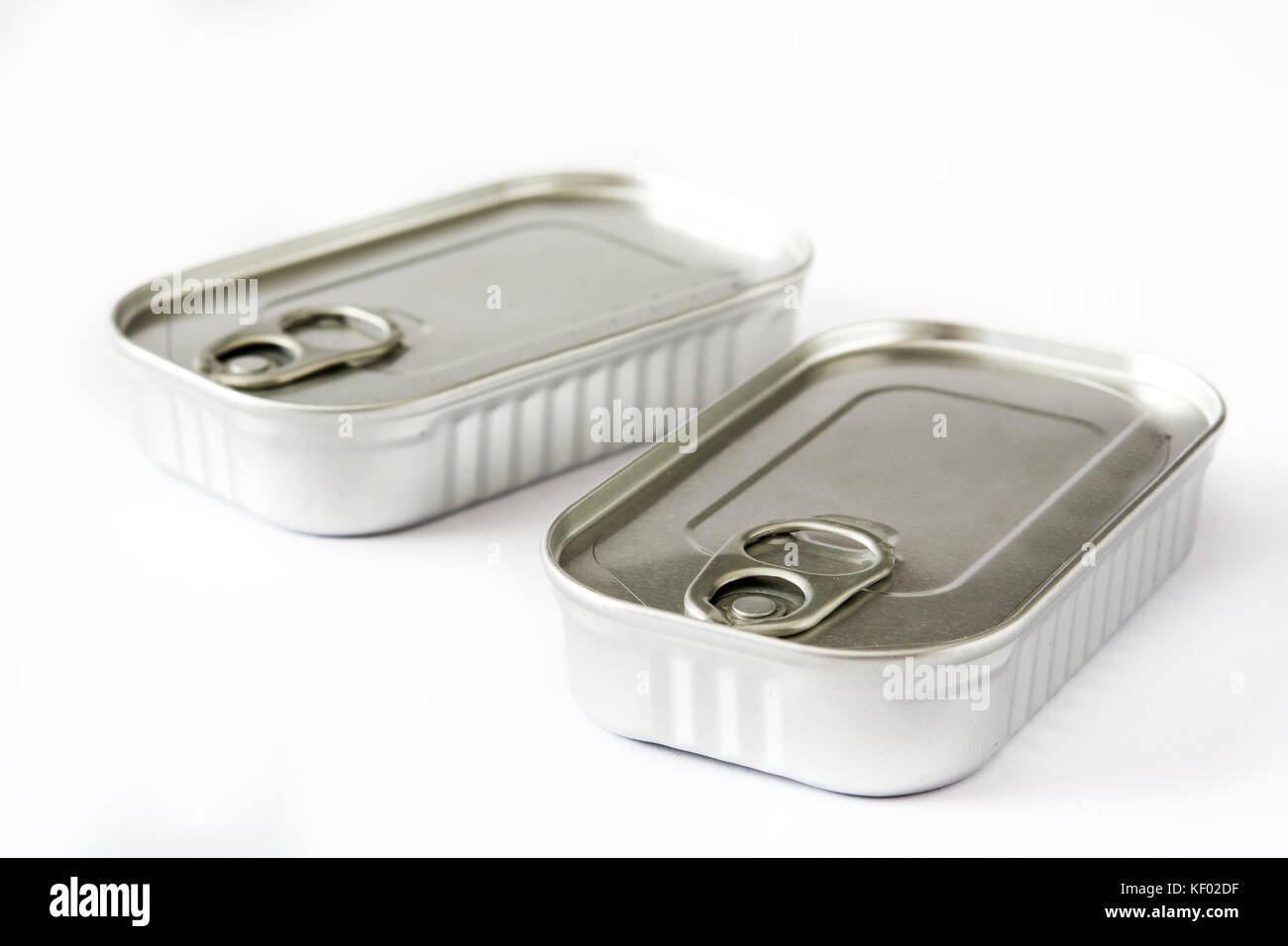 Closed cans of preserves isolated on white background Stock Photo - Alamy