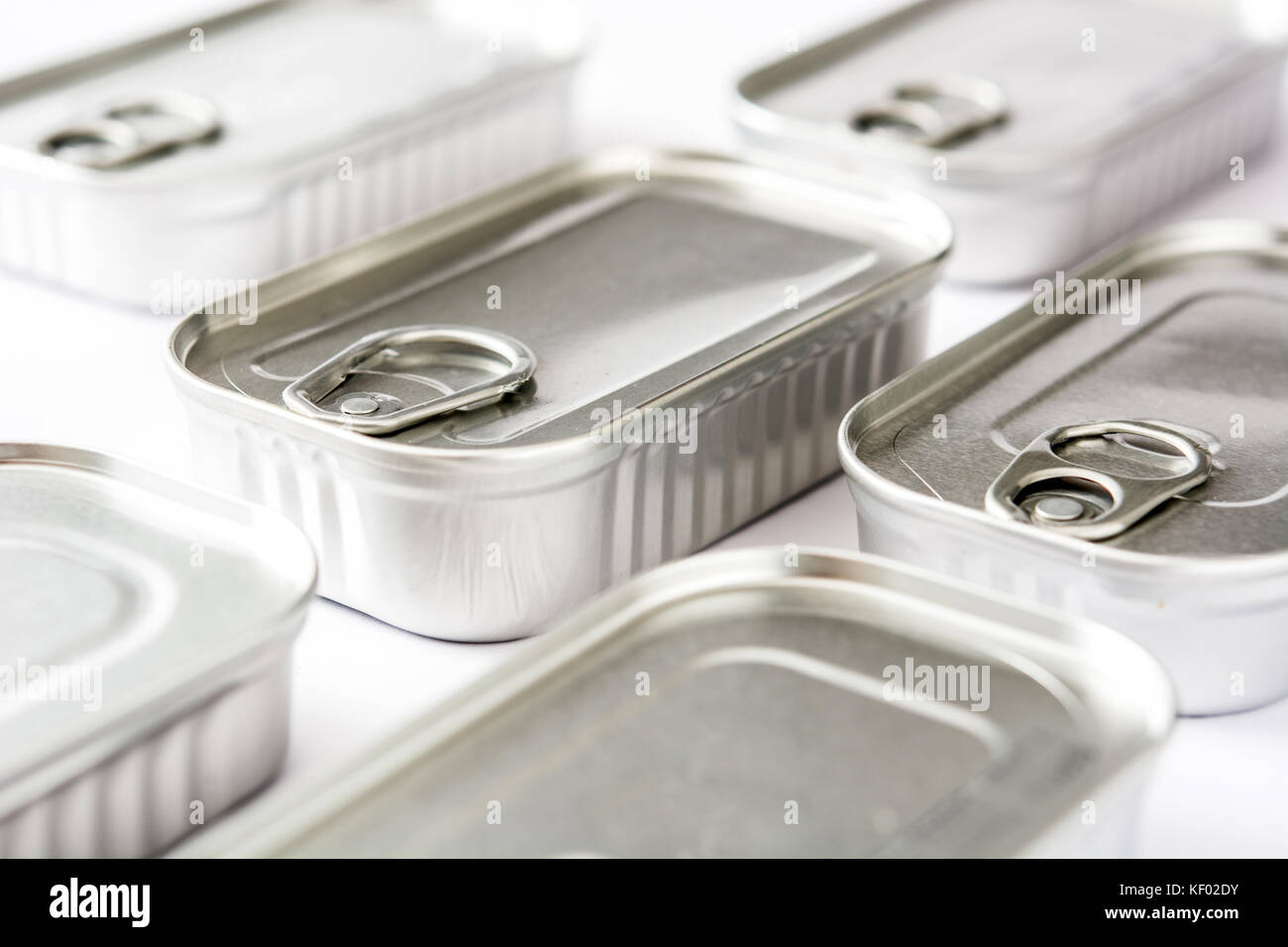 Closed cans of preserves isolated on white background Stock Photo - Alamy