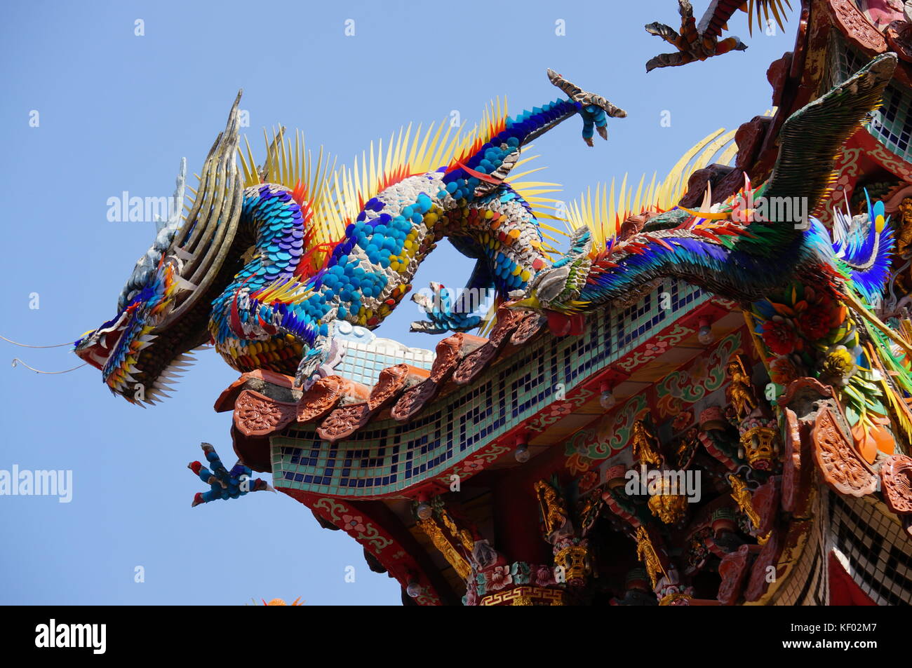 Dragon on rooftop Stock Photo - Alamy