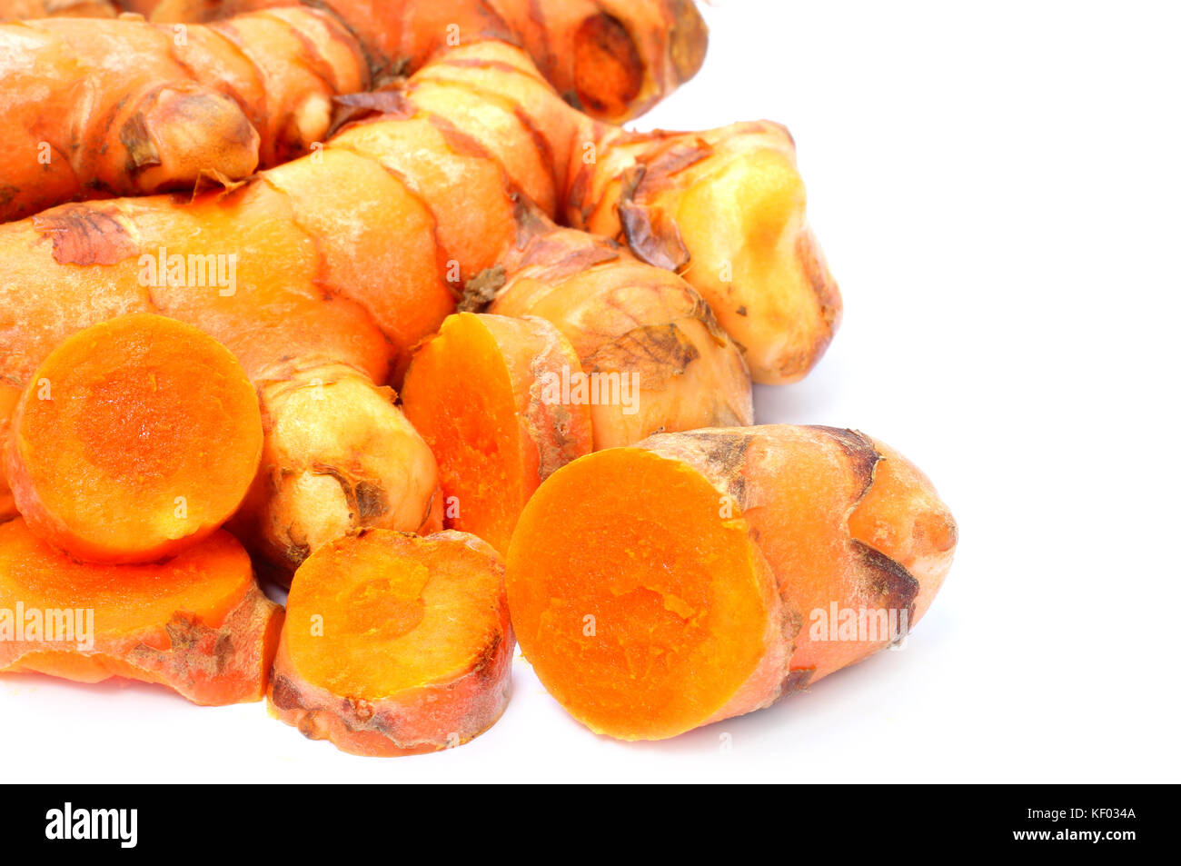 Slices herbal turmeric over white background Stock Photo - Alamy
