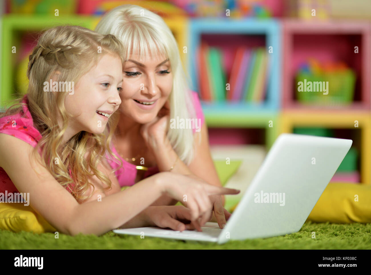 mother and daughter using laptop Stock Photo - Alamy