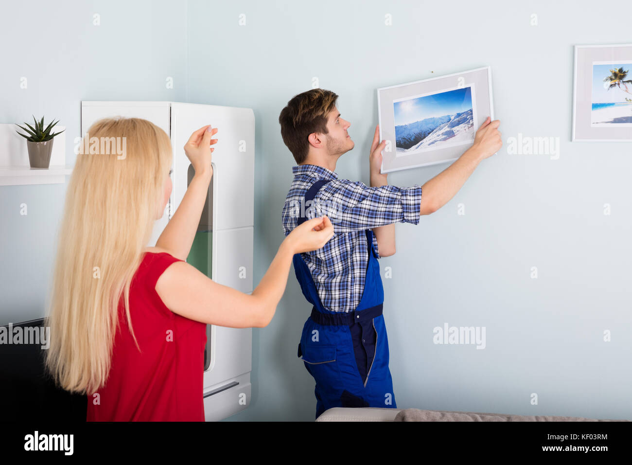 Photo frame on wall with two people hi-res stock photography and images ...