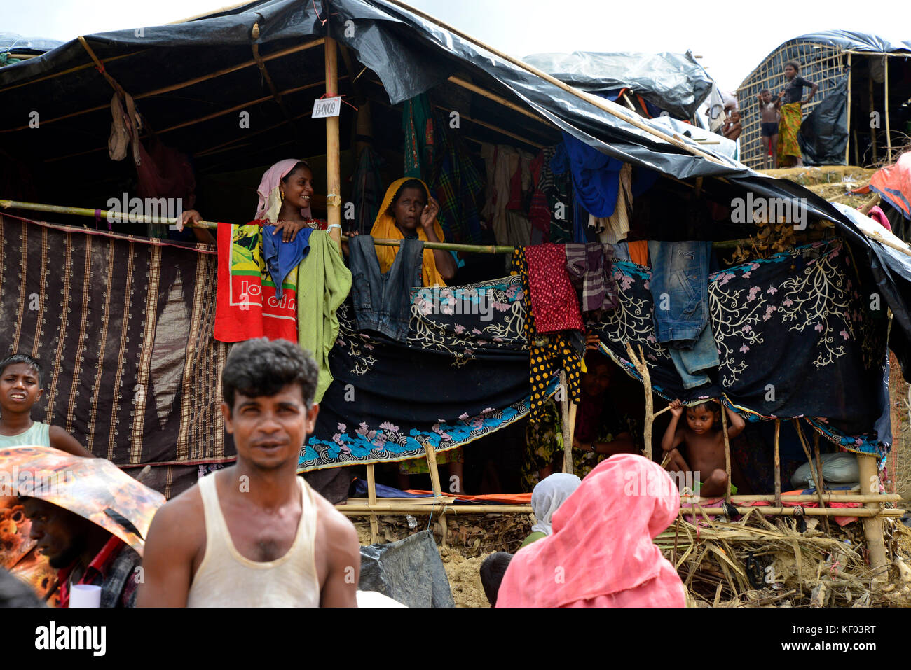 A Rohingya refugee family member sits in their house at the palongkhali ...