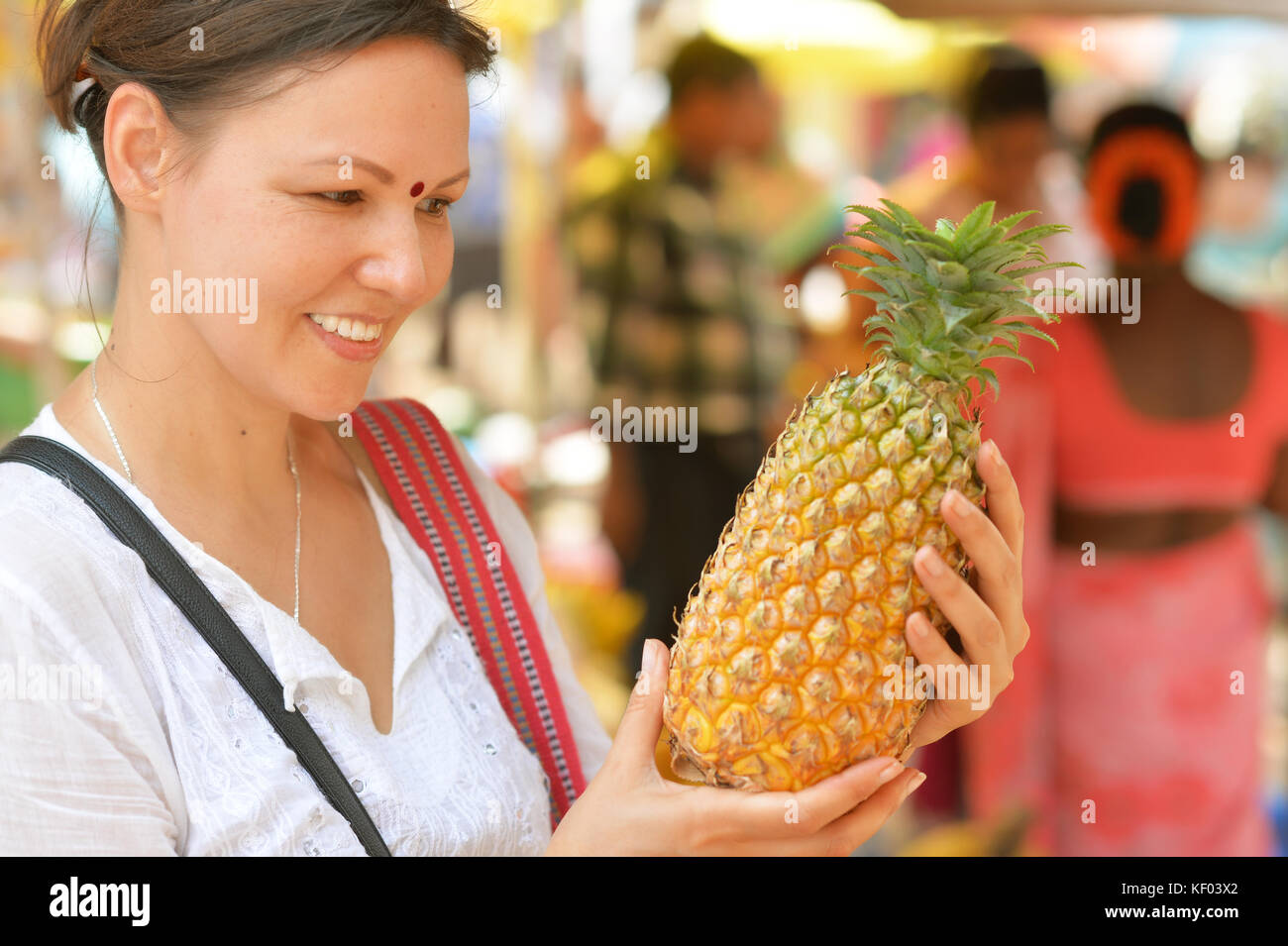 woman choosing fruits on market Stock Photo - Alamy