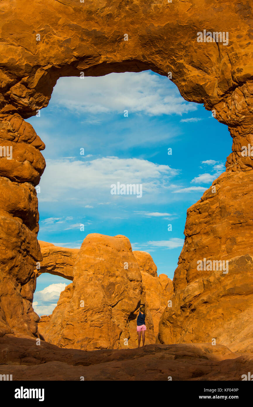 South window arch seen from a girl through Turret arch, Arches National ...