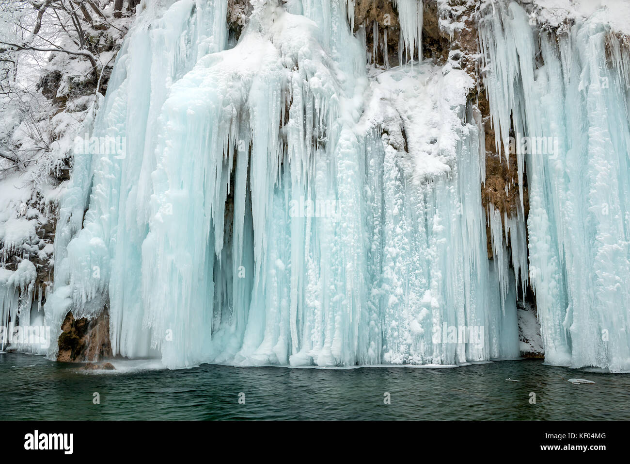Icicles hang from a frozen waterfall, Plitvice Lakes National Park ...
