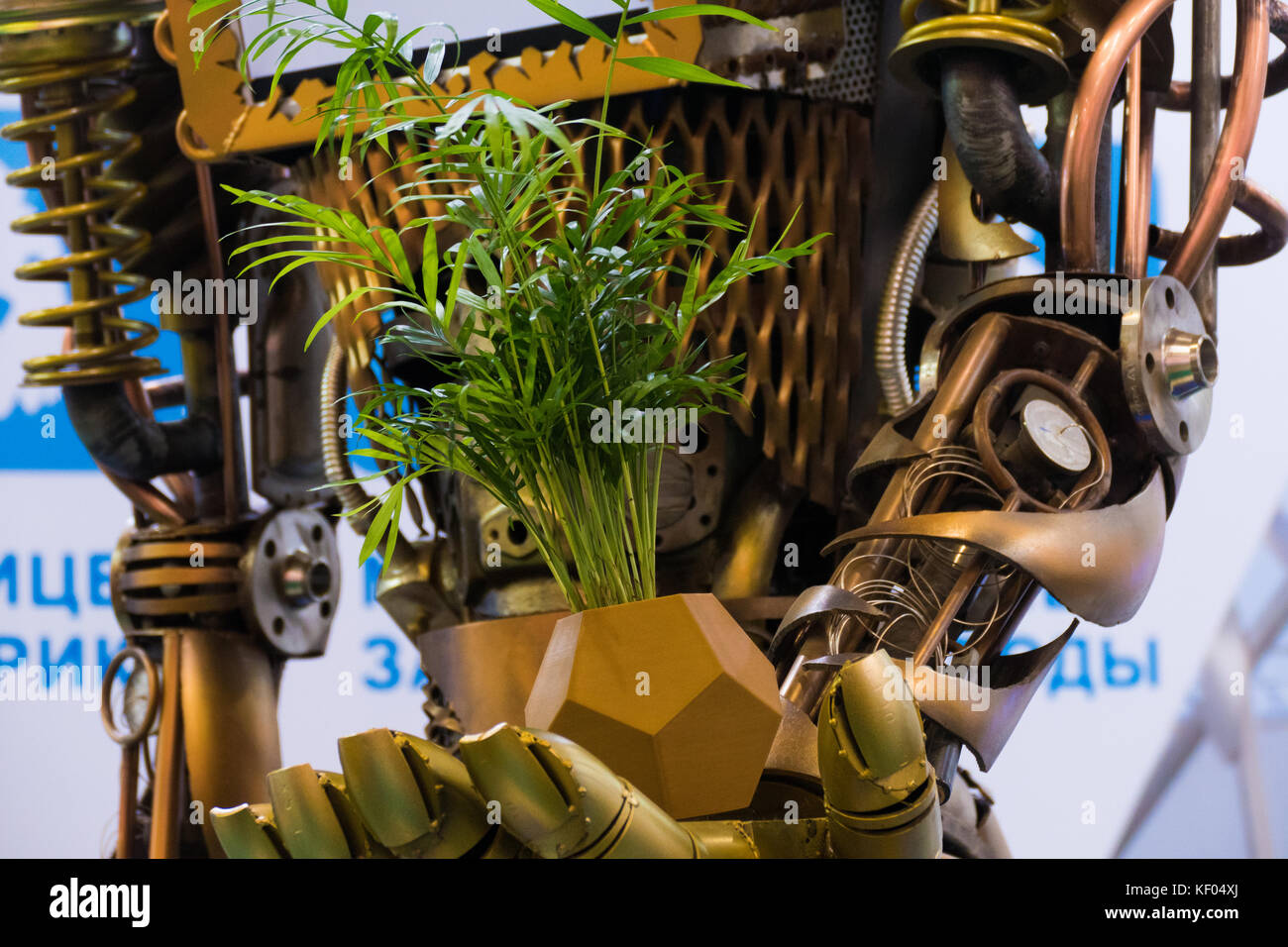 robot metal holds a plant Stock Photo - Alamy