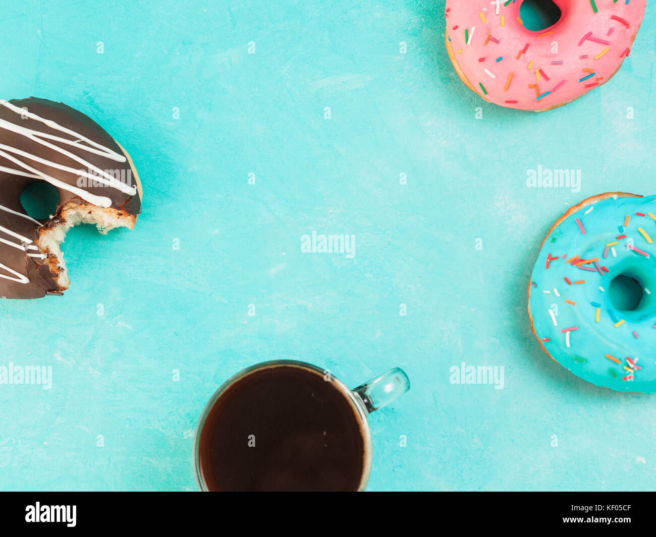 donuts on blue background , copy space, top view Stock Photo - Alamy