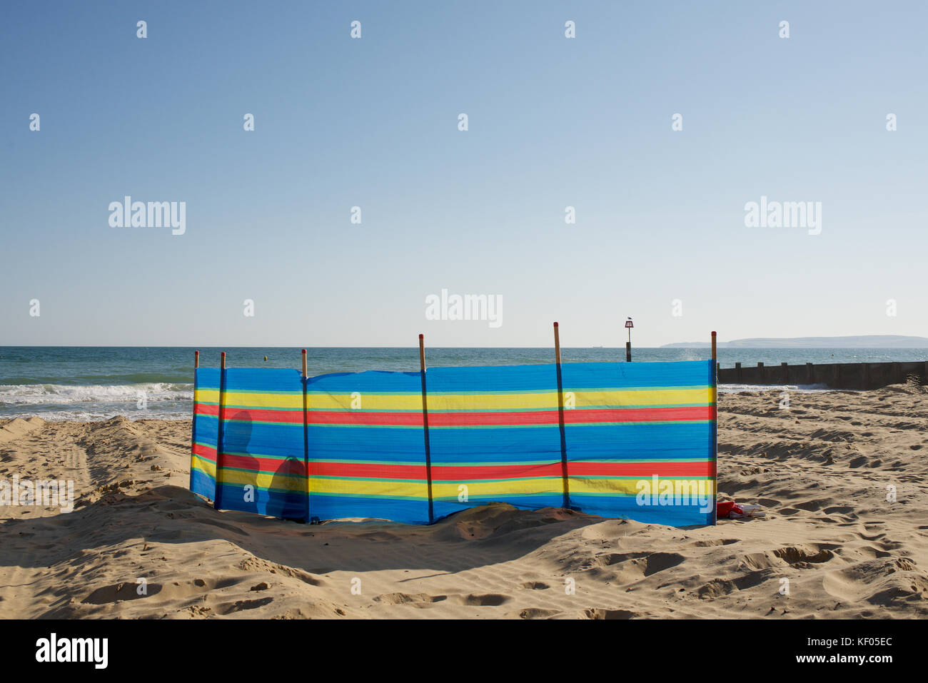 Striped wind breaker on the beach Stock Photo - Alamy