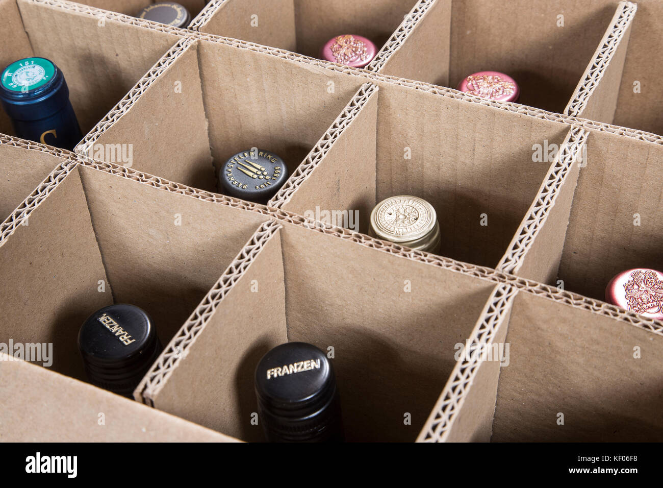 A 12 bottle brown cardboard wine box with bottles photographed on a ...