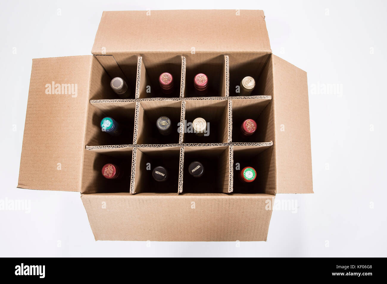 A 12 bottle brown cardboard wine box with bottles photographed on a ...