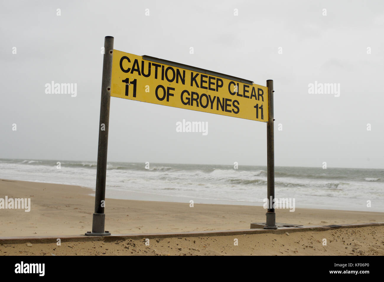 Caution sign on a beach Stock Photo - Alamy